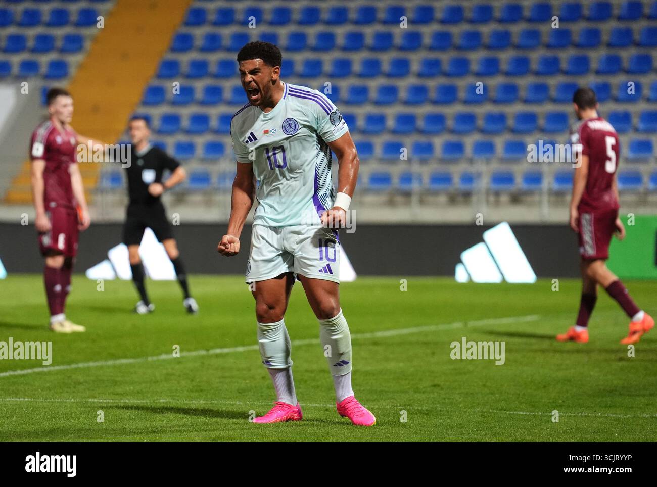 Scotland's Che Adams celebrates scoring their side's first goal of the ...