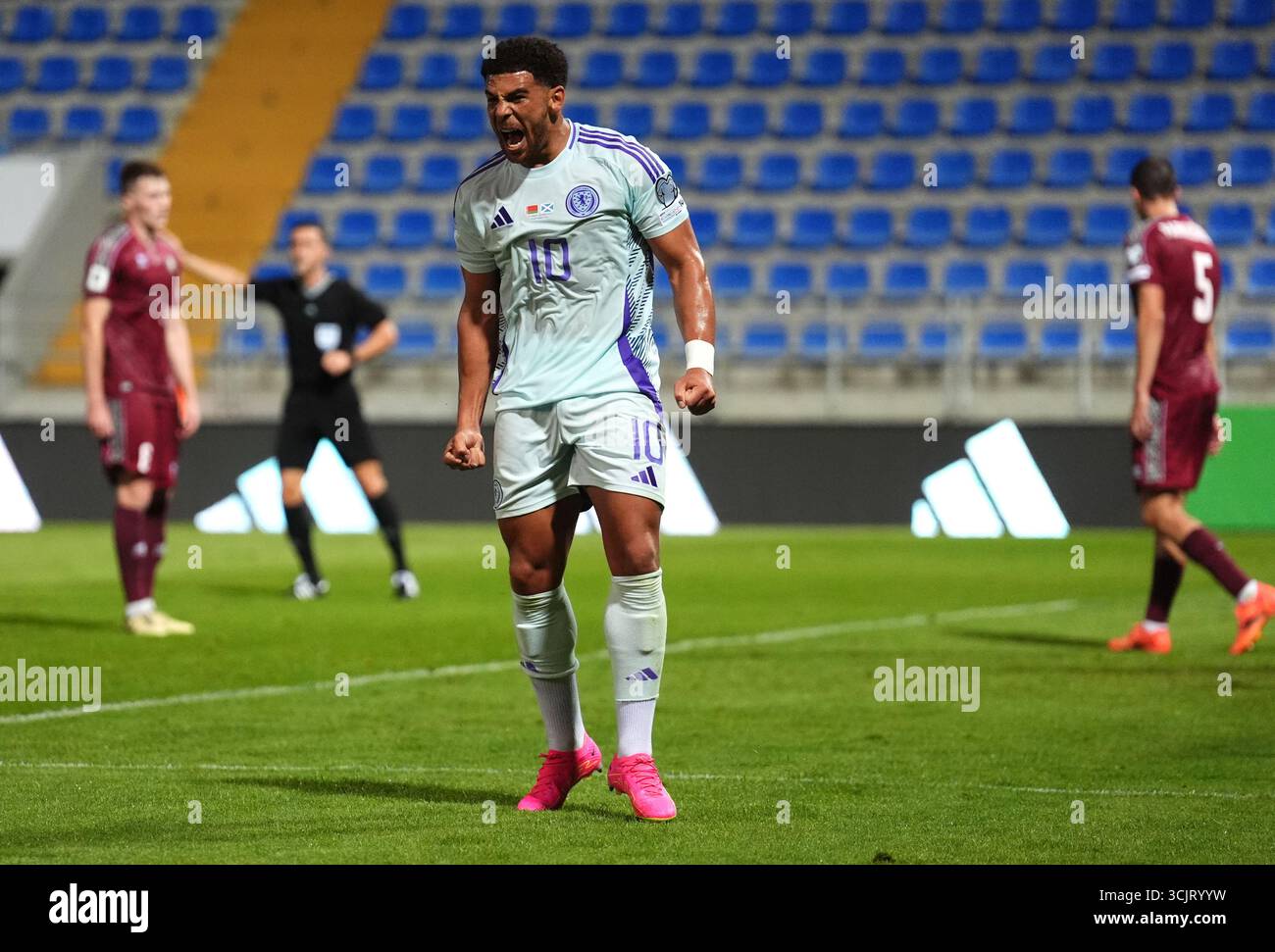 Scotland's Che Adams celebrates scoring their side's first goal of the ...