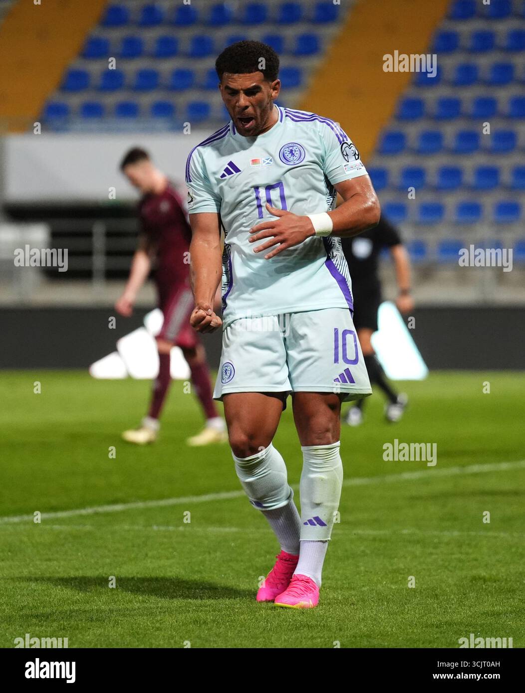 Scotland's Che Adams celebrates scoring their side's first goal of the ...