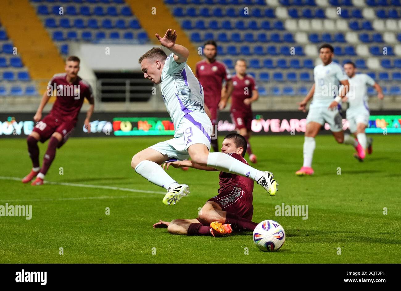 Belarus' Yegor Parkhomenko challenges Scotland's Lewis Ferguson during ...