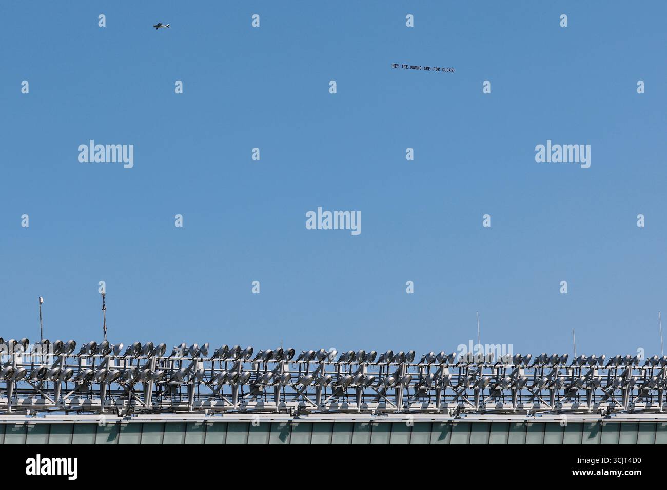 A plane with anti ICE sign is flying over Soldier Field before an NFL ...
