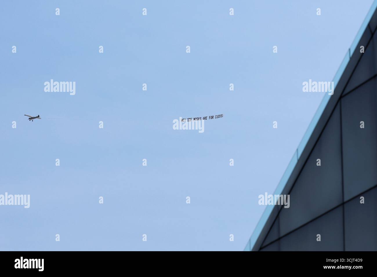 A plane with anti ICE sign is flying over Soldier Field before an NFL ...