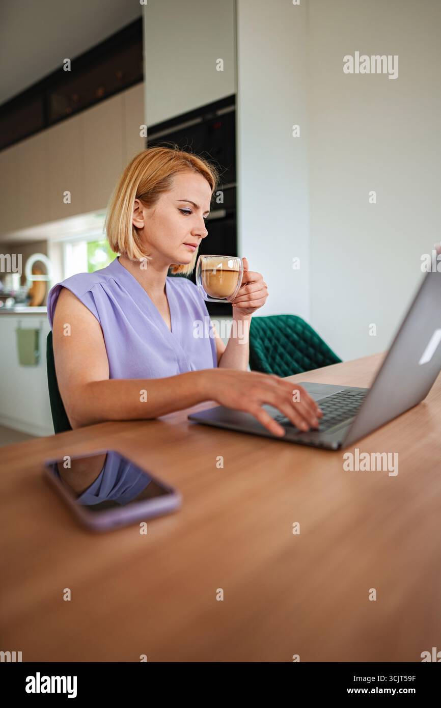Woman sips coffee using hi-res stock photography and images - Alamy