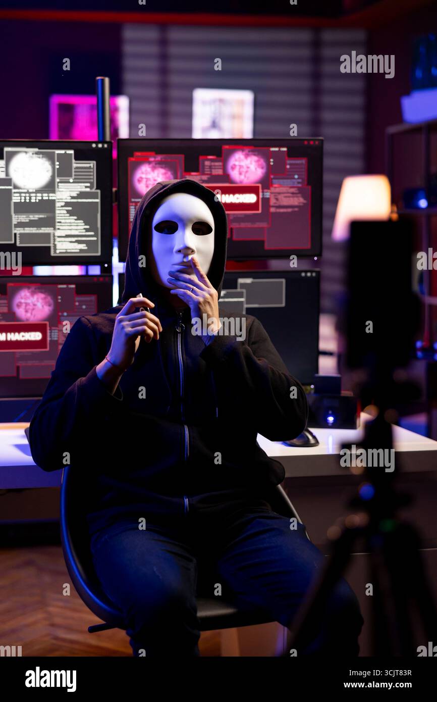 Hacker concealing identity filming hi-res stock photography and images ...