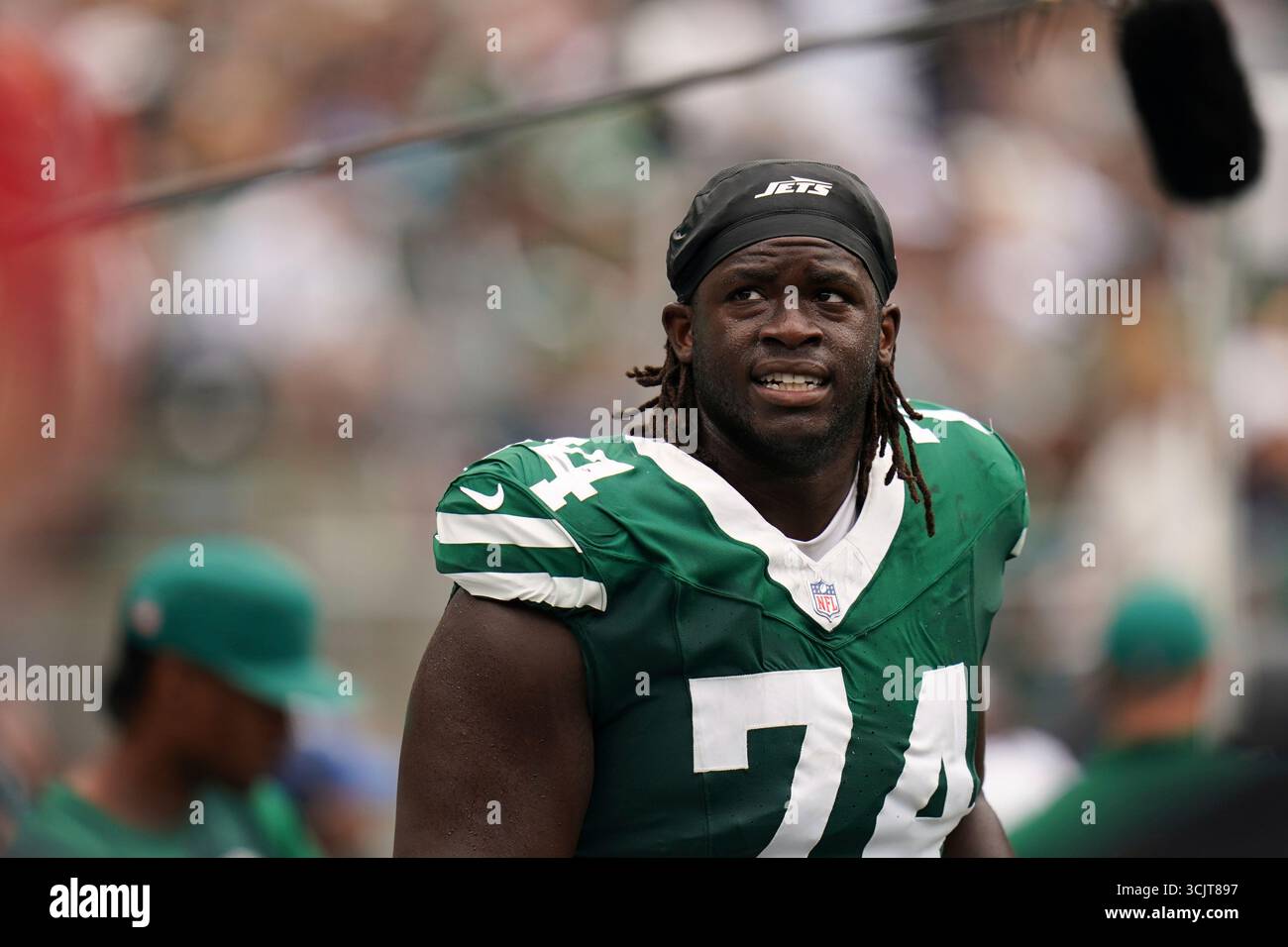 New York Jets offensive tackle Olu Fashanu (74) on the sidelines during ...