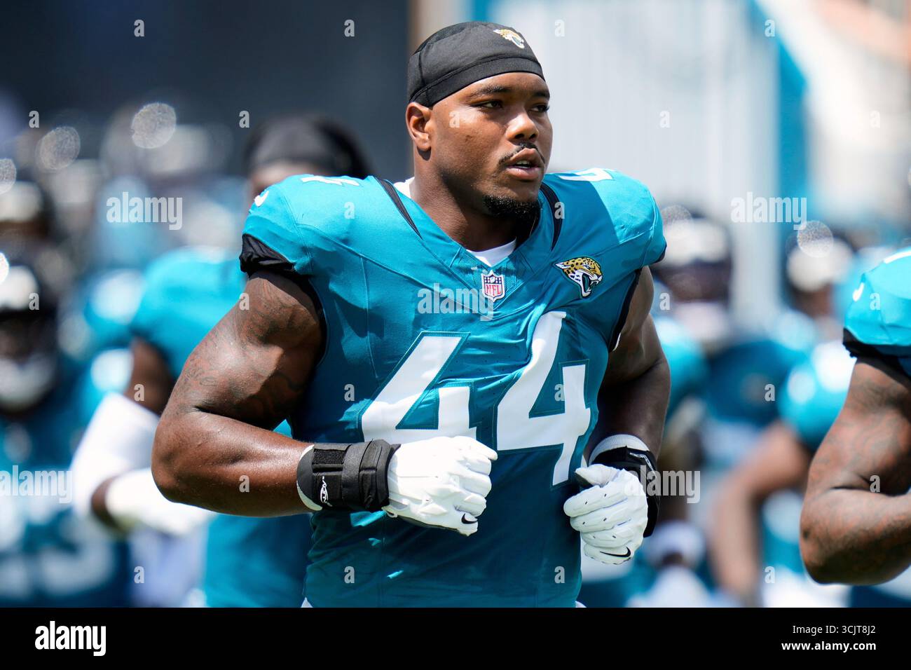 Jacksonville Jaguars defensive end Travon Walker (44) runs on the field ...