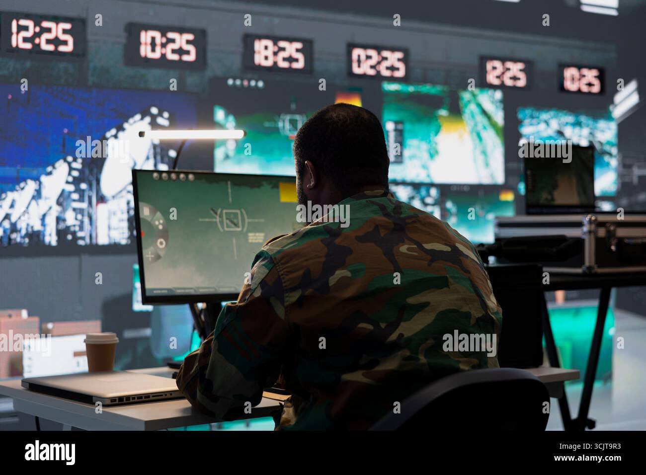 Air defense division operative using radar on computer to detect ...