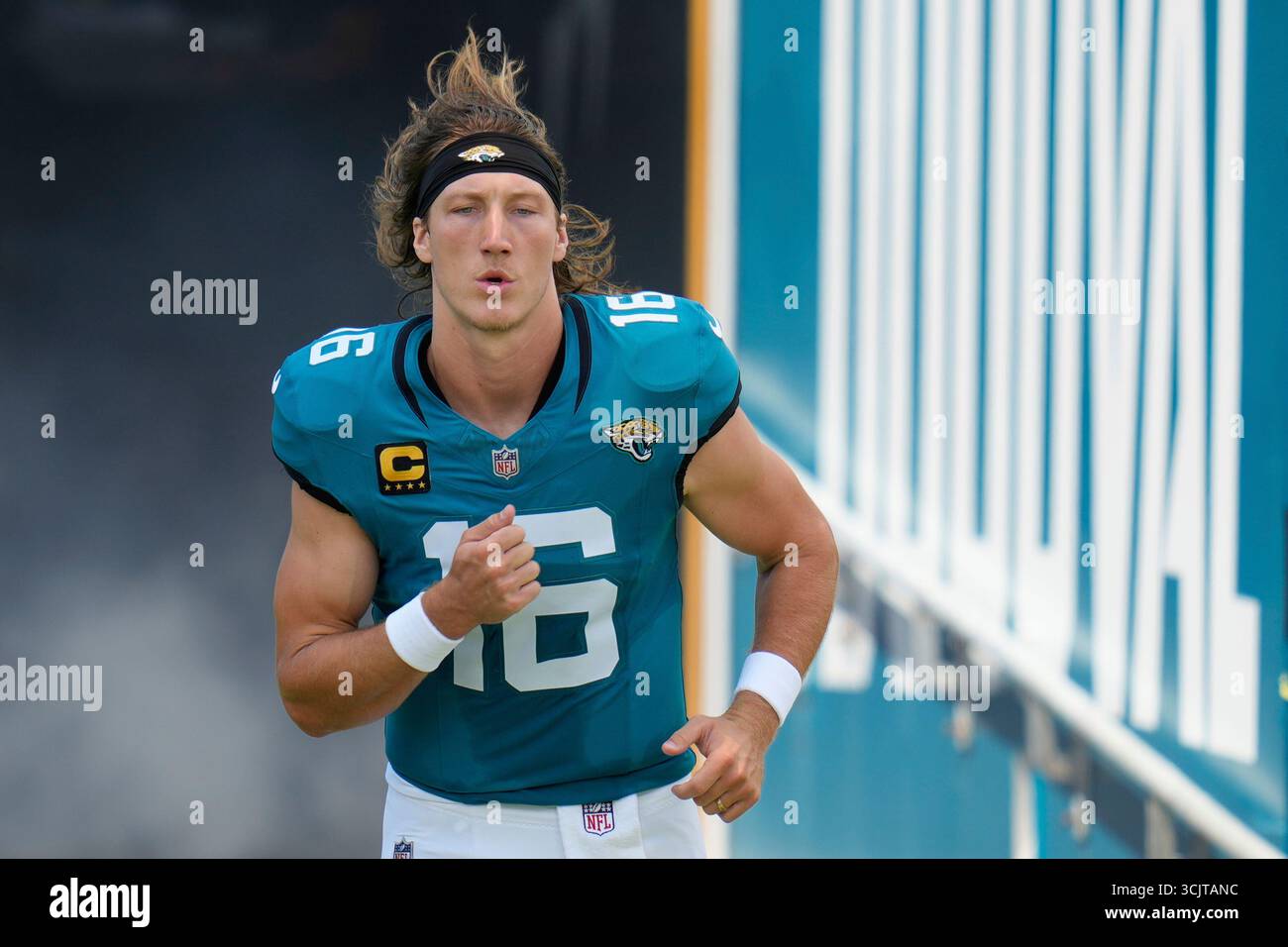 Jacksonville Jaguars quarterback Trevor Lawrence (16) runs on the field ...