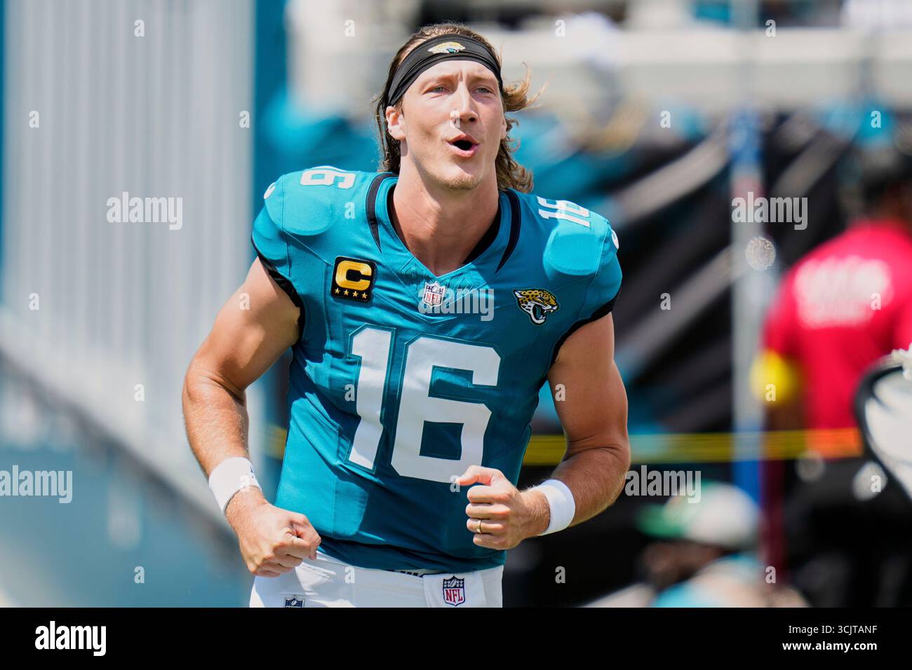 Jacksonville Jaguars quarterback Trevor Lawrence (16) runs on the field ...