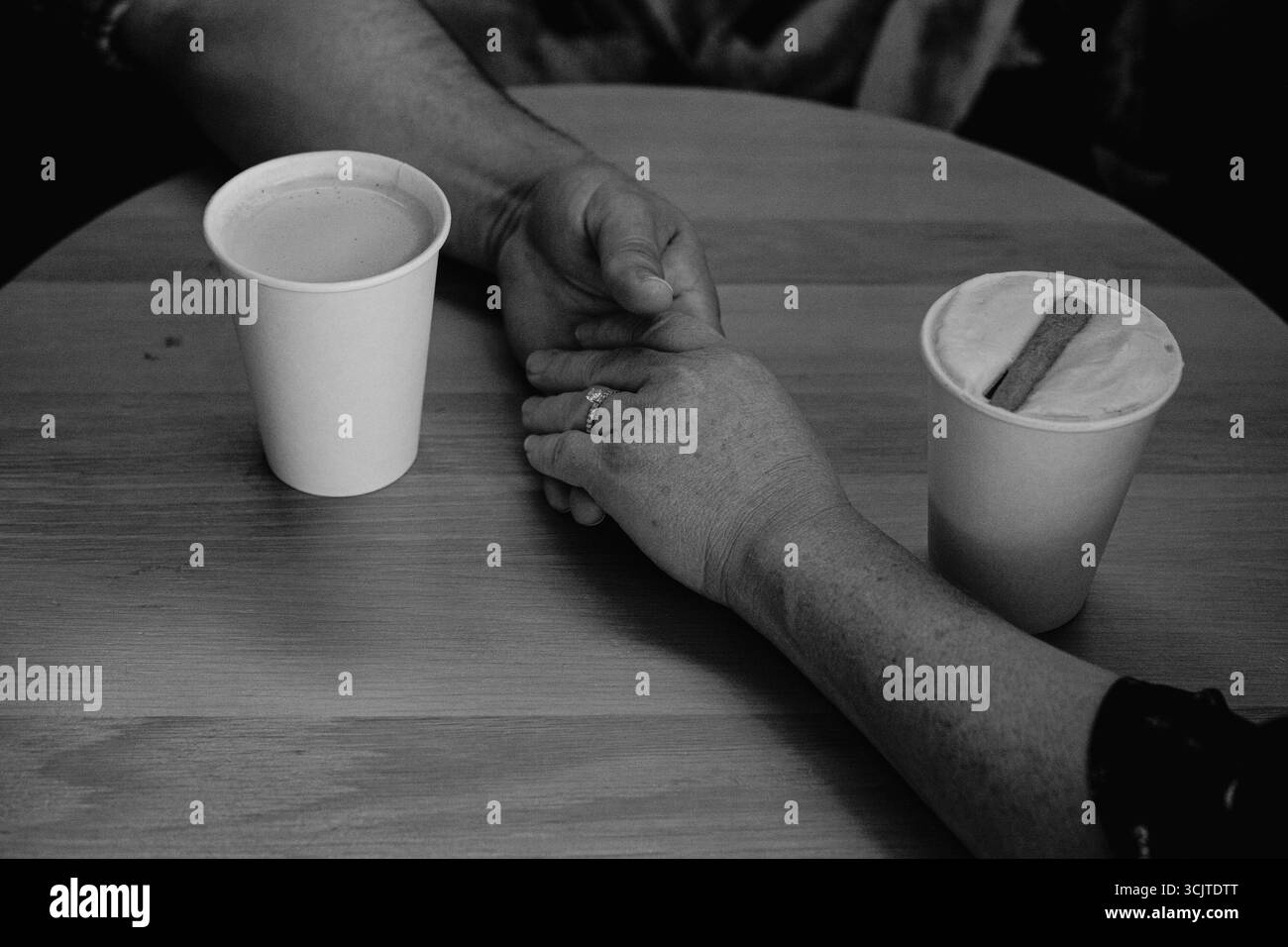Hand holding table Black and White Stock Photos & Images - Alamy