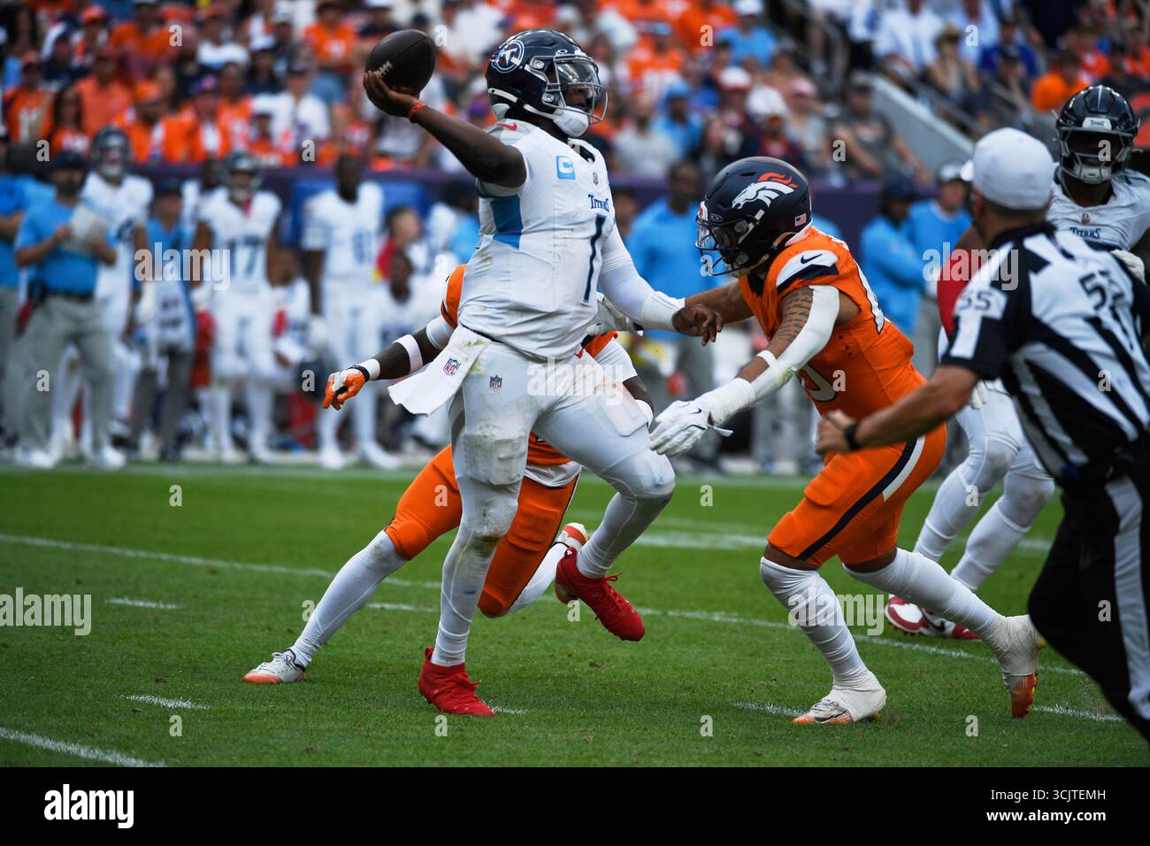 Tennessee Titans quarterback Cam Ward (1) passes the ball as Denver ...