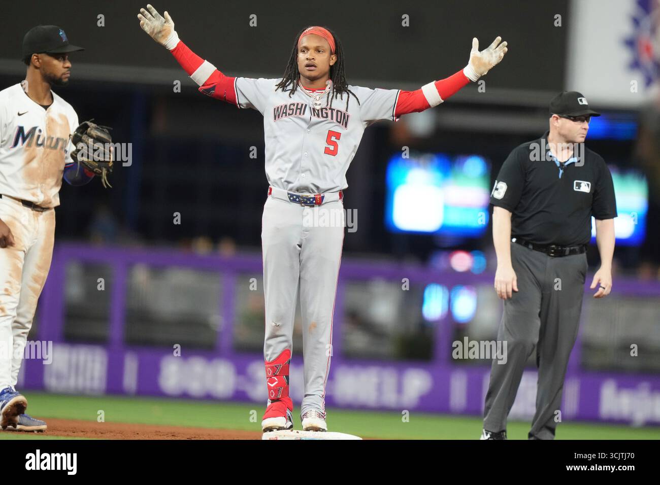 Washington Nationals' CJ Abrams (5) reacts after hitting a double during the fifth inning of a ...