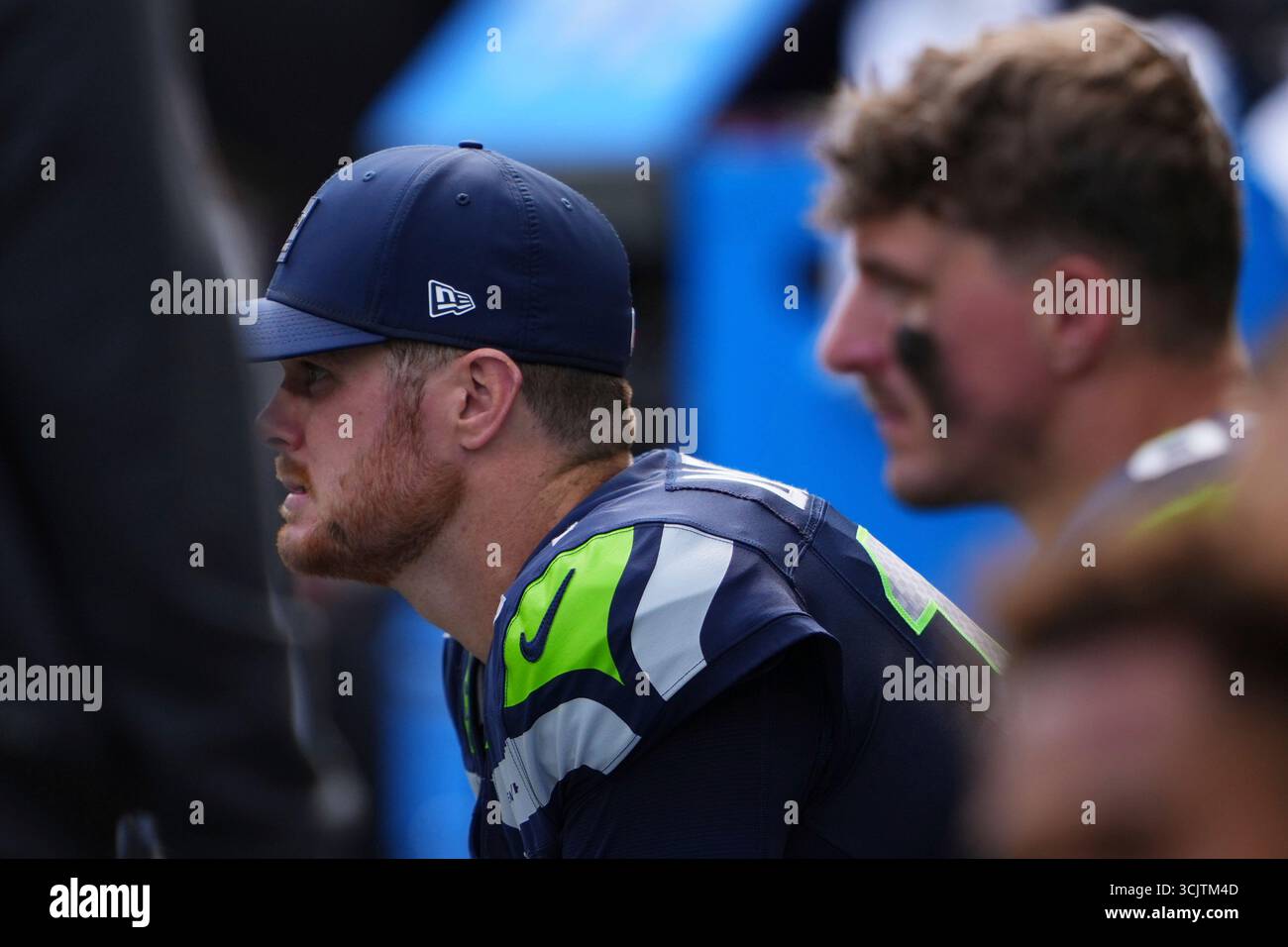 Seattle Seahawks quarterback Sam Darnold sits on the bench during an ...