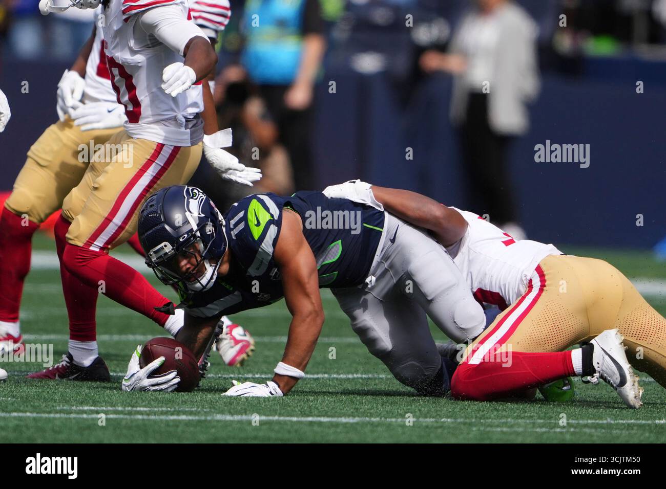 Seattle Seahawks wide receiver Jaxon Smith-Njigba is tackled during an NFL football game against ...