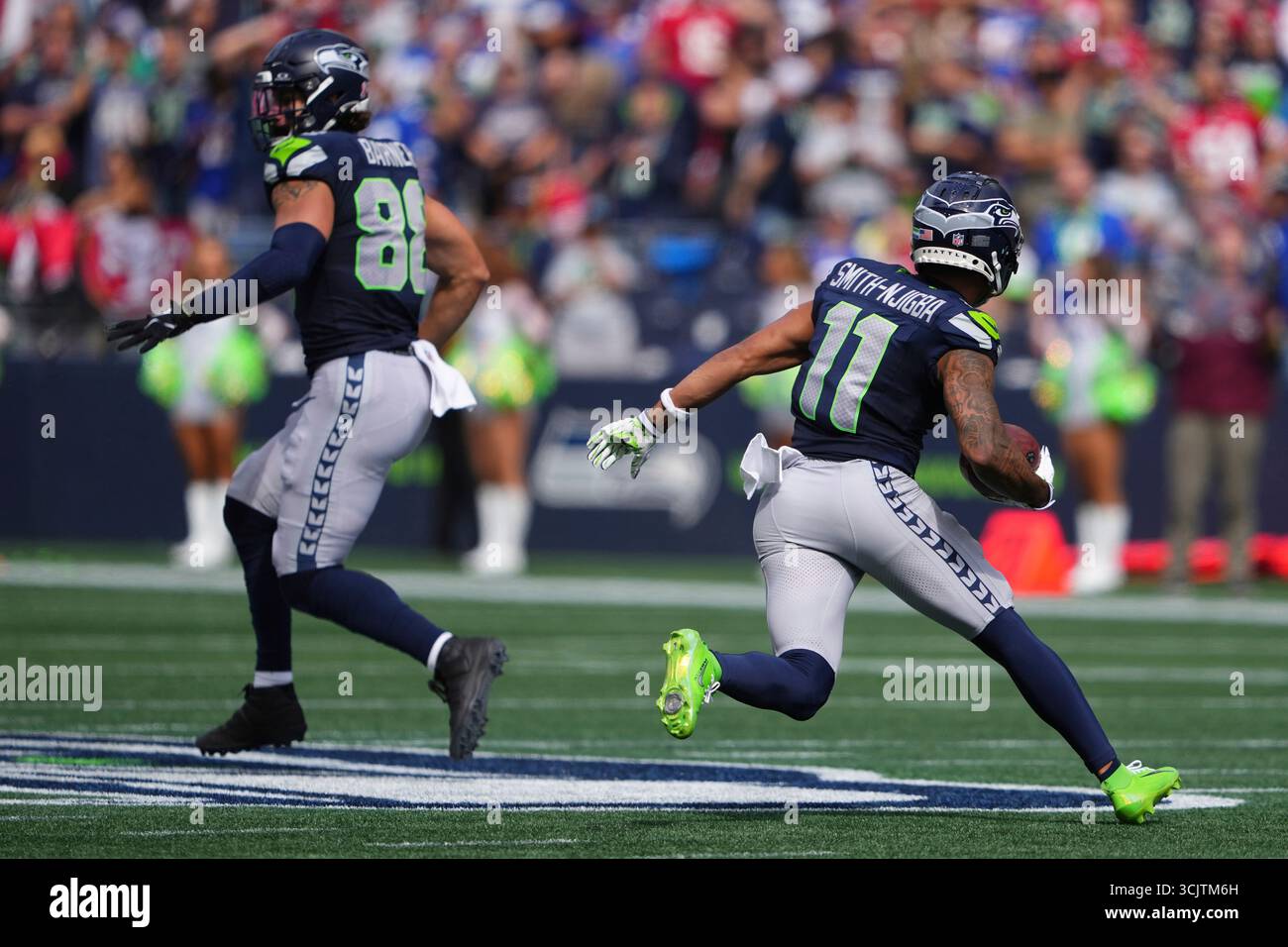 Seattle Seahawks wide receiver Jaxon Smith-Njigba (11) runs the ball against the San Francisco ...