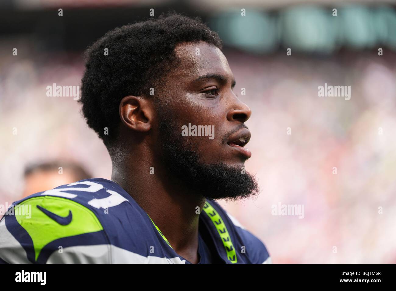 Seattle Seahawks cornerback Devon Witherspoon (21) walks off the field ...