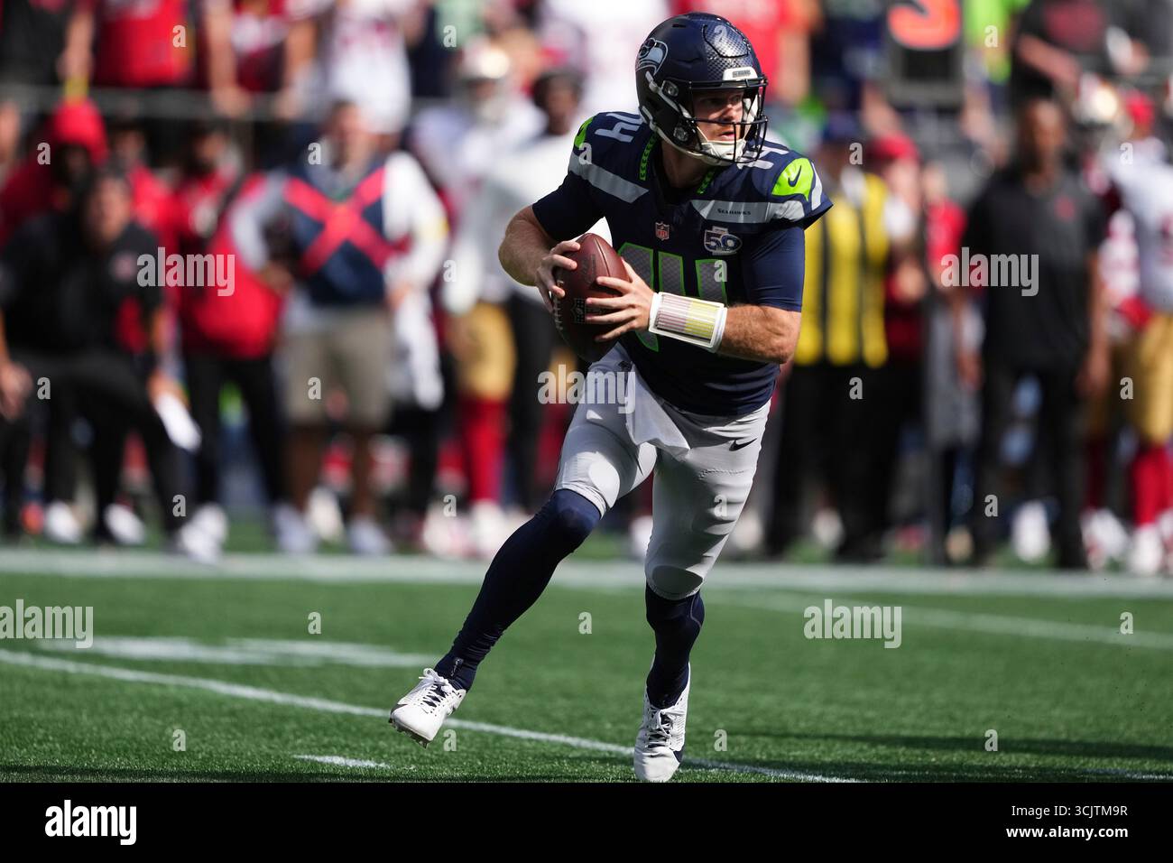 Seattle Seahawks quarterback Sam Darnold runs the ball against the San Francisco 49ers during an ...