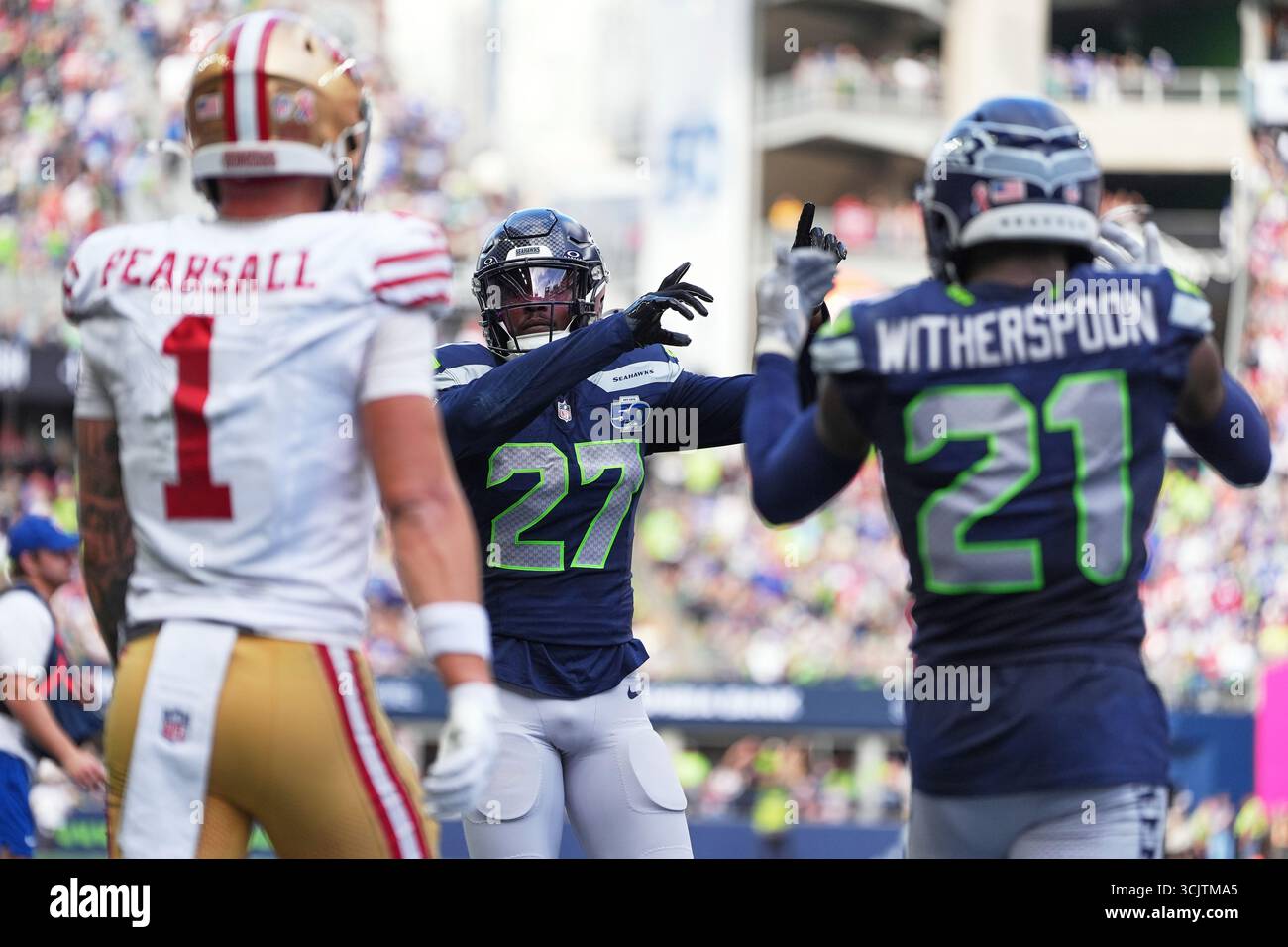 Seattle Seahawks cornerback Riq Woolen (27) reacts with cornerback ...