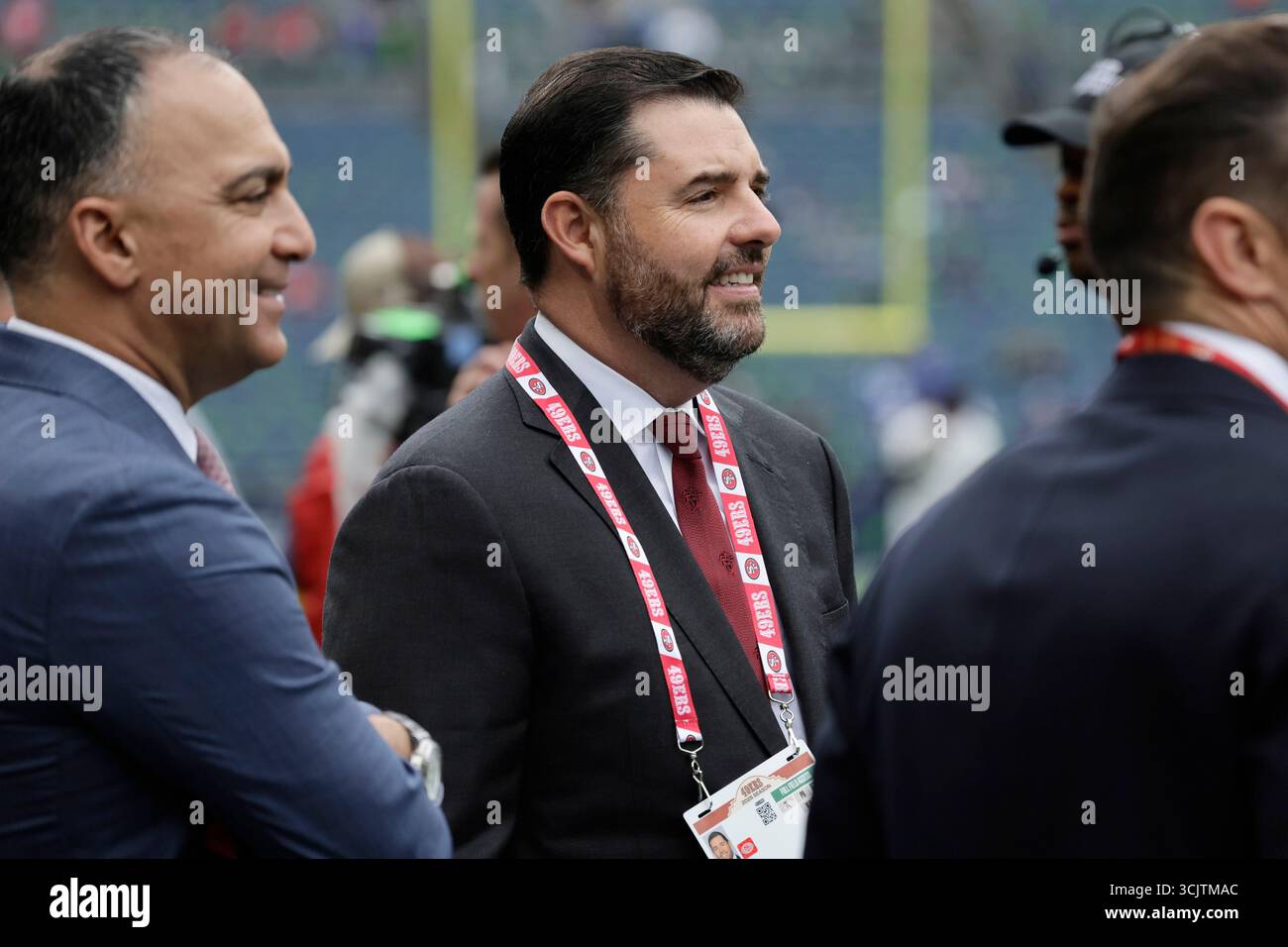San Francisco 49ers principal owner Jed York, center, talks on the ...