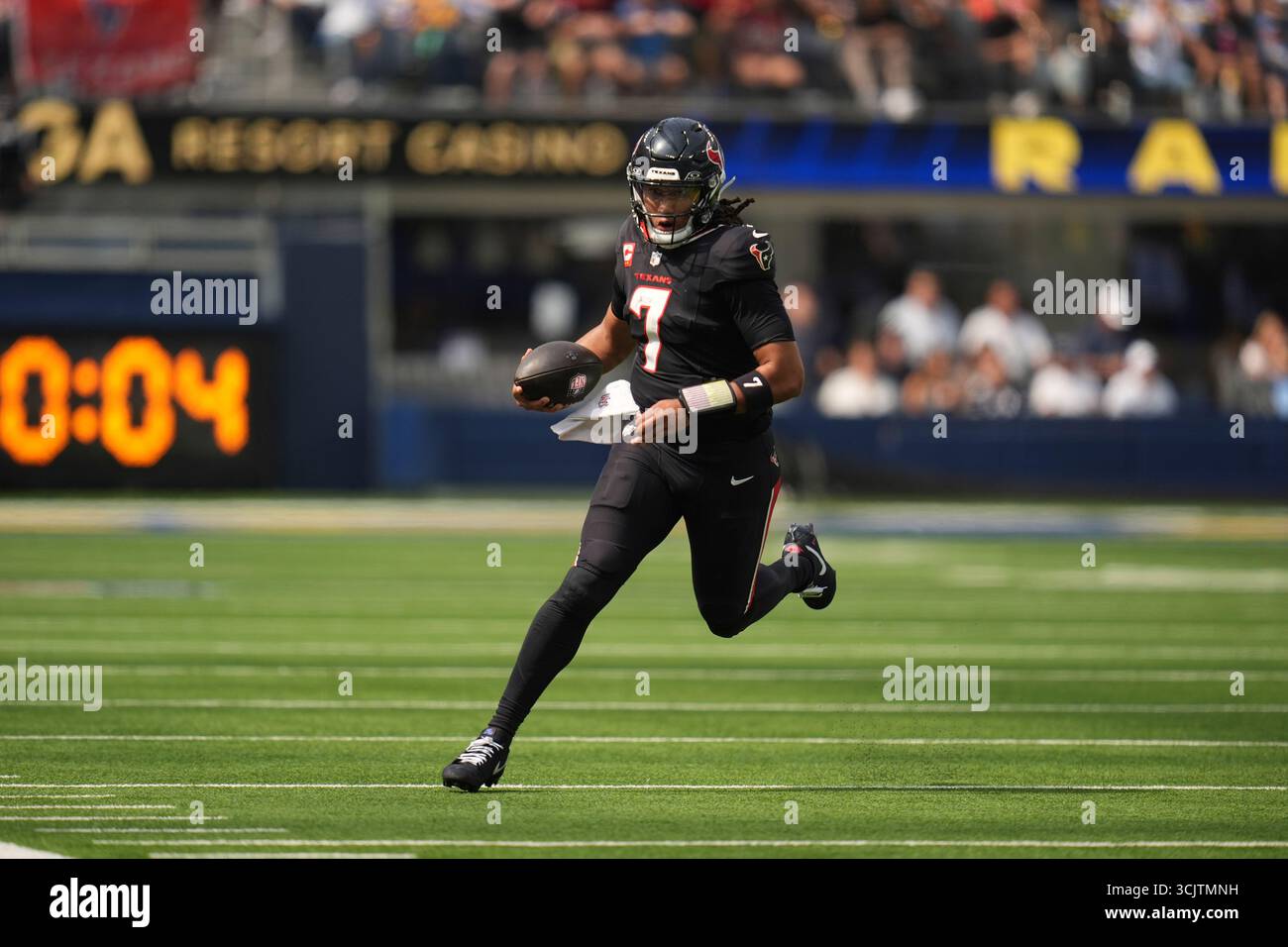 Houston Texans quarterback C.J. Stroud (7) scrambles with the ball of ...