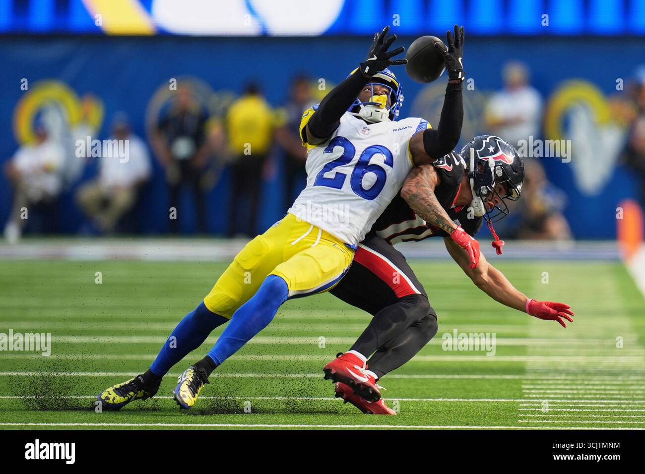 Los Angeles Rams safety Kamren Kinchens (26) battles Houston Texans wide receiver Jared Wayne ...