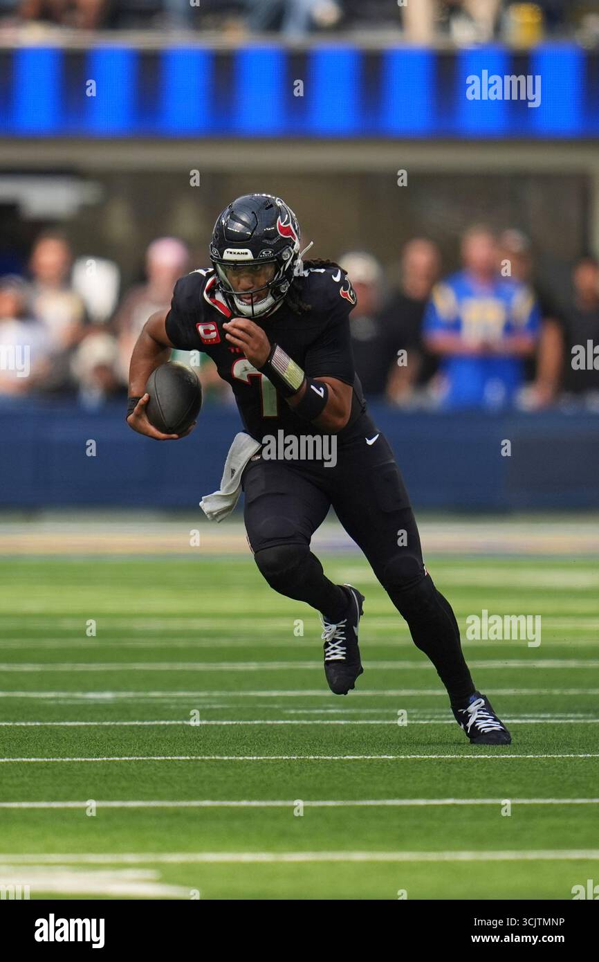 Houston Texans quarterback C.J. Stroud (7) scrambles with the ball of ...