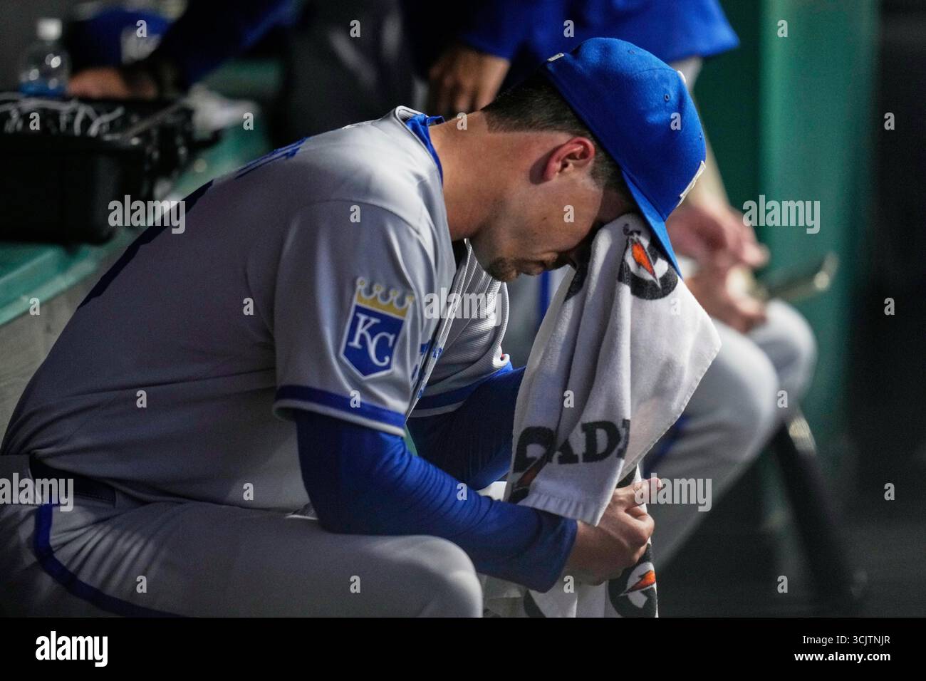 Kansas City Royals starting pitcher Ryan Bergert wipes his face in the ...