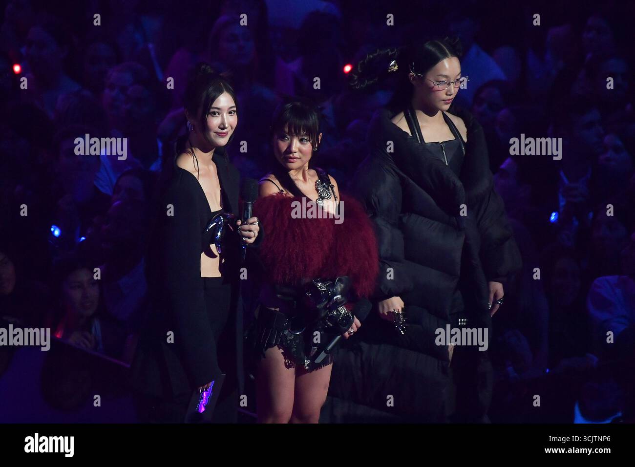 EJAE, Rei Ami, and Audrey Nuna of HUNTR/X onstage during the 2025 MTV ...