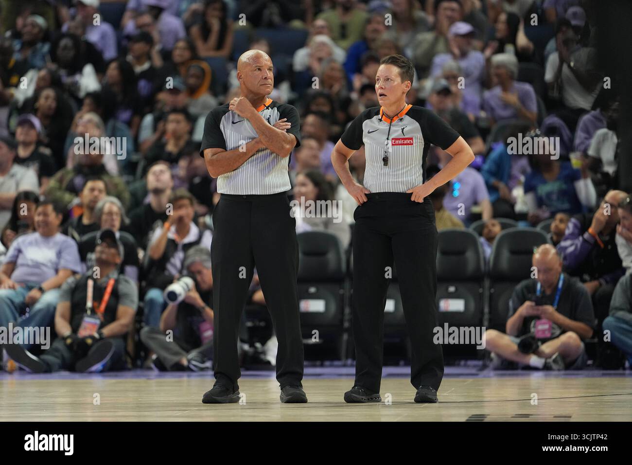 Refeere Tim Greene and Gina Cross during a time out of the the Golden ...