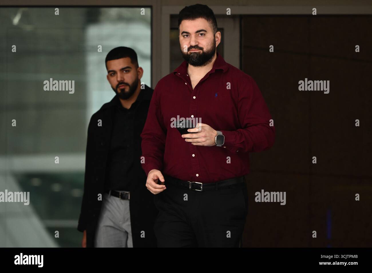 Burgertory owner Hasheam "Hash" Tayeh (right) departs the Melbourne ...