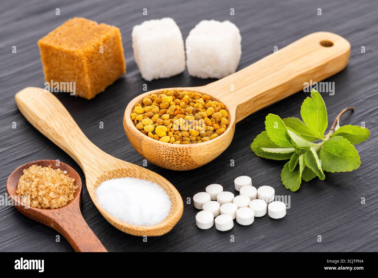 Variety of sweeteners, stevia, pollen, refined sugar, and brown sugar ...