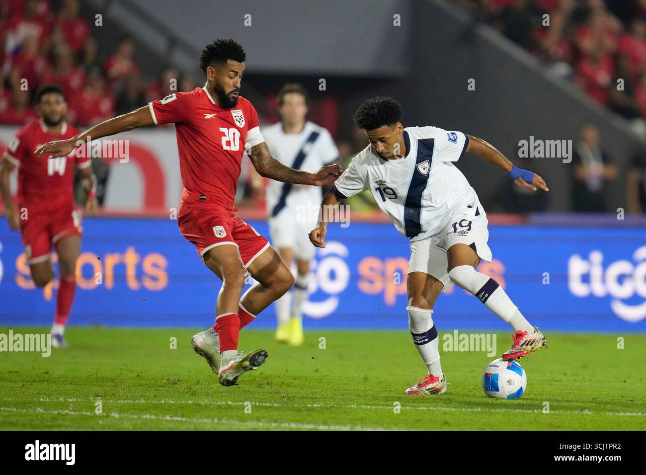 Guatemala's Arquimidez Ordonez, right, controls the ball past Panama's ...