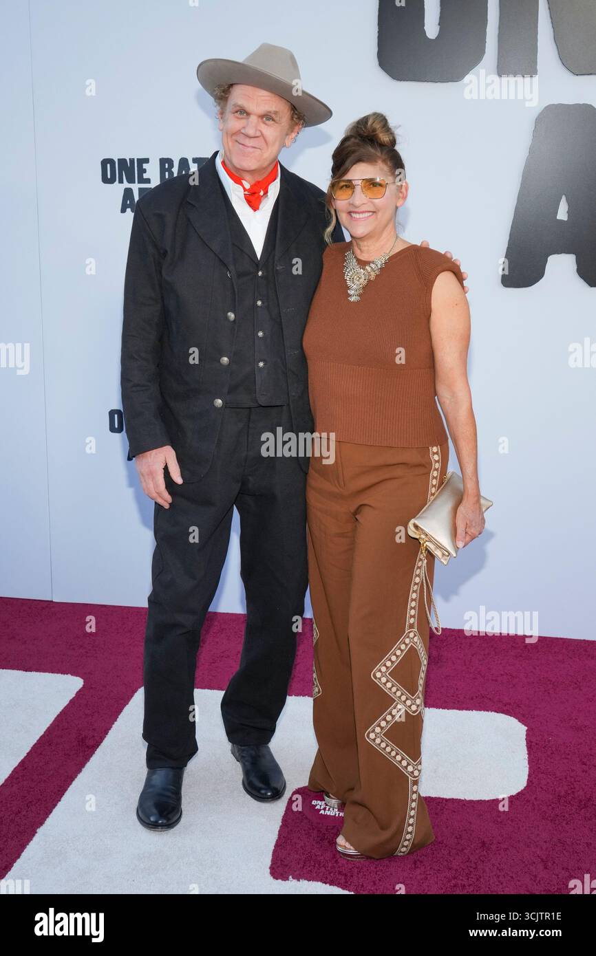 John C. Reilly, left, and Alison Dickey arrive at the premiere of "One ...