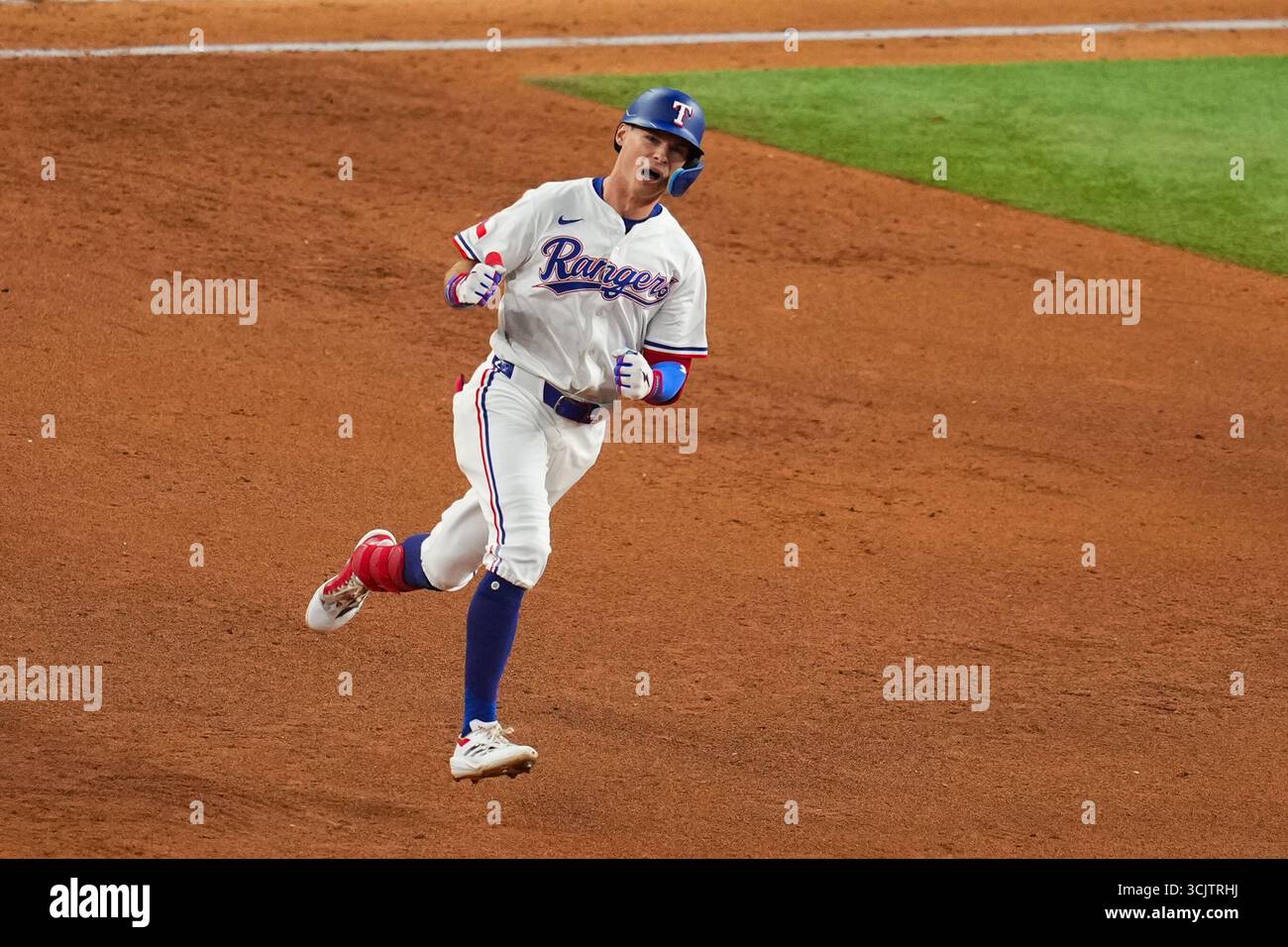 Texas Rangers' Michael Helman reacts after hitting a grand slam home run off Milwaukee Brewers ...