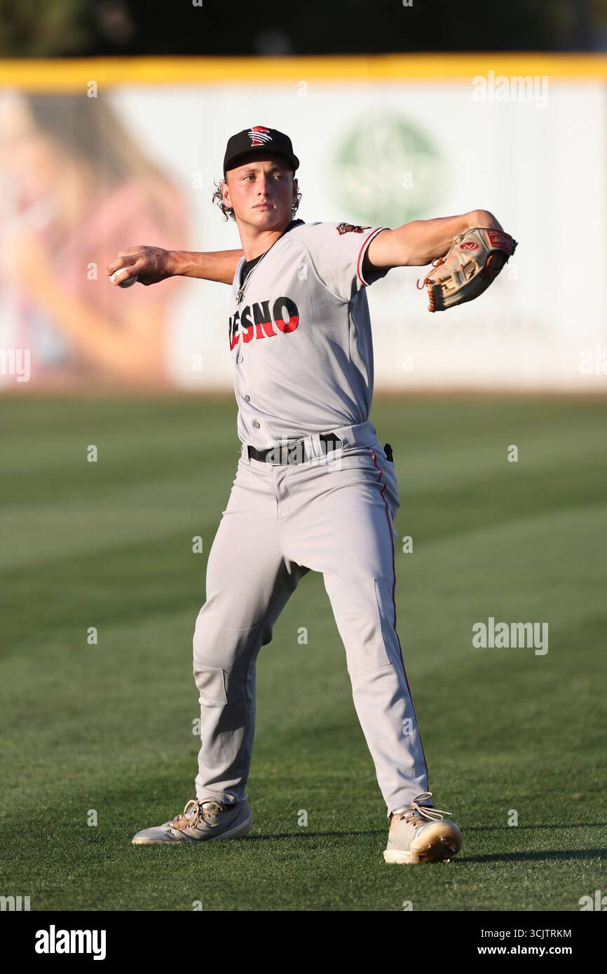 Ethan Holliday (18) of the Fresno Grizzlies throws before a game ...