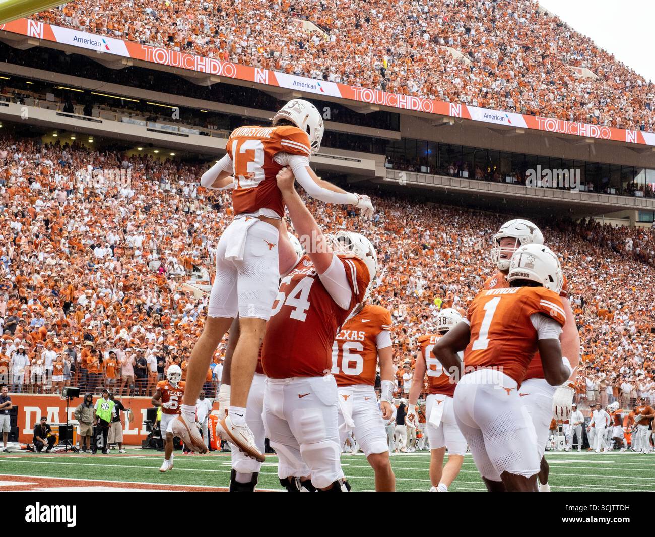 Texas receiver Parker Livingstone (13) celebrates his touchdown catch ...