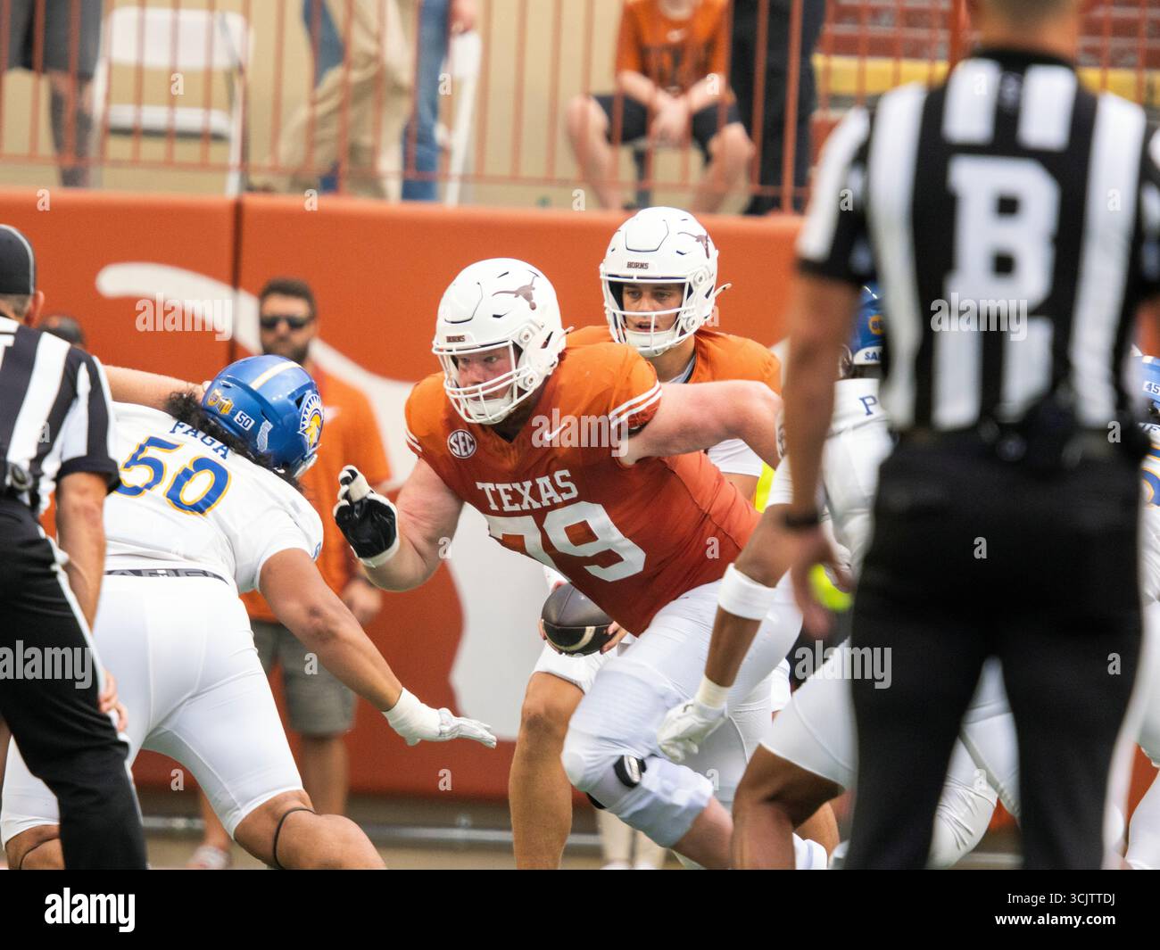 Texas offfensive lineman Connor Stroh, center, blocks for Texas ...