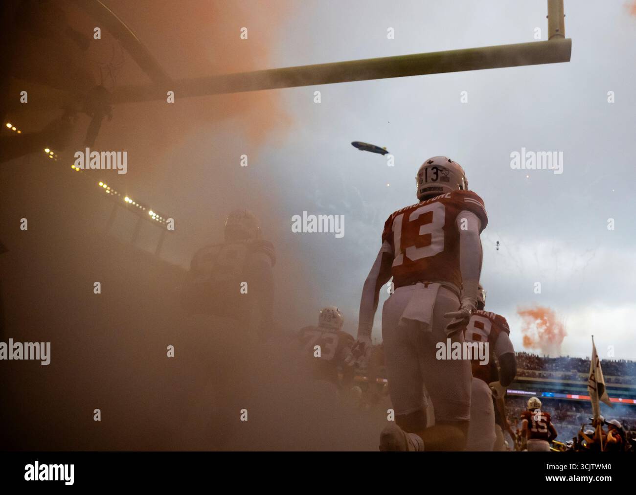 Texas receiver Parker Livingston runs onto the filed before the start ...