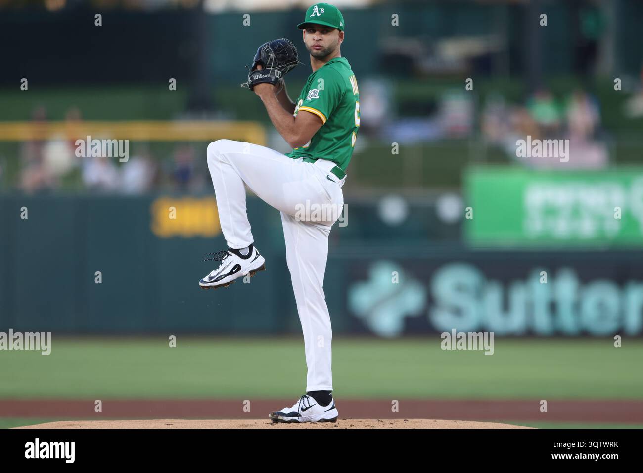 Athletics pitcher Luis Morales winds up to throw to an Boston Red Sox ...