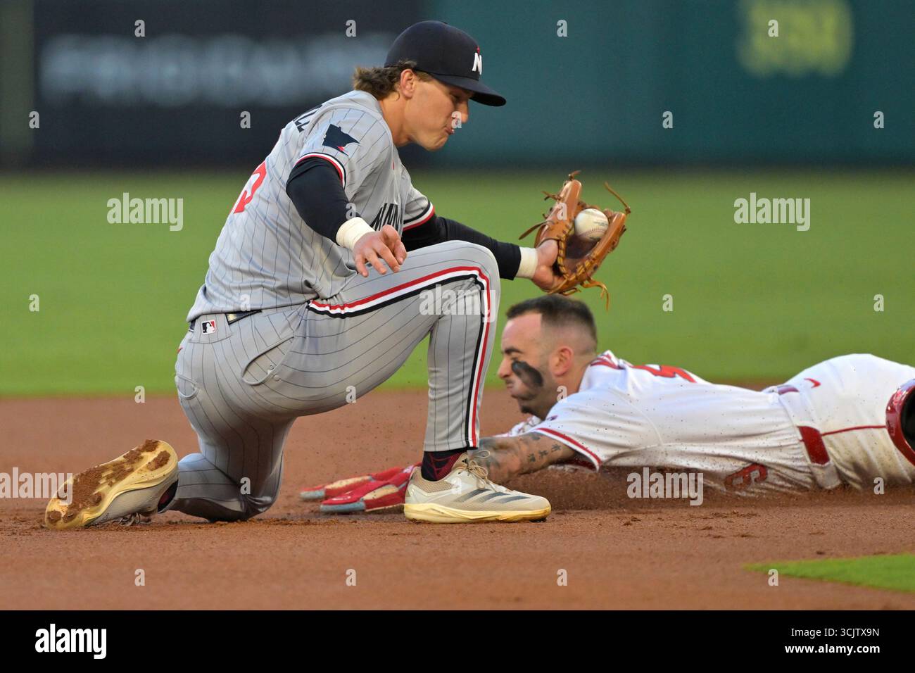 Los Angeles Angels Zach Neto, right, beats the throw to Minnesota Twins ...