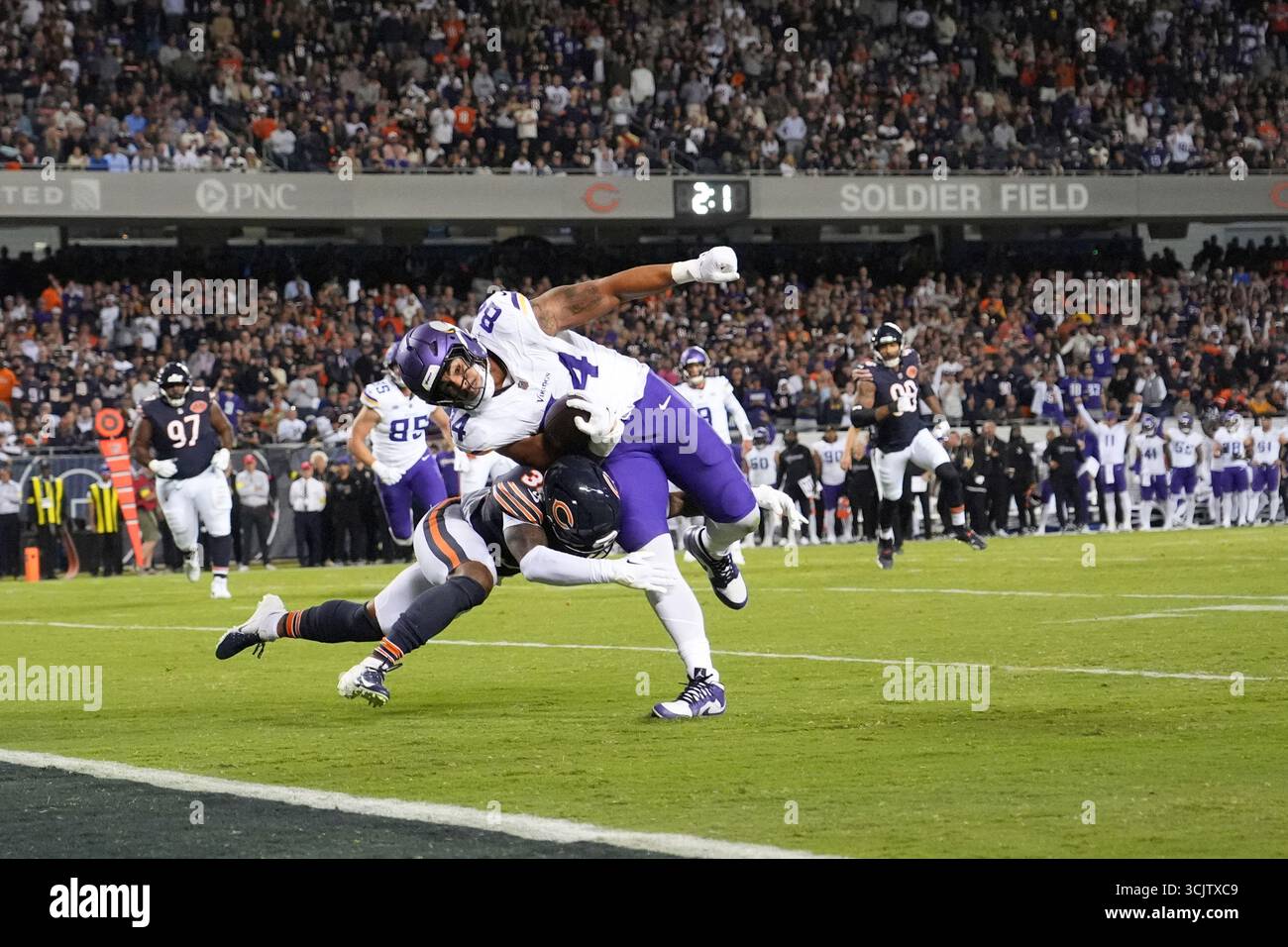 Minnesota Vikings tight end Josh Oliver, right, is stopped short of the ...