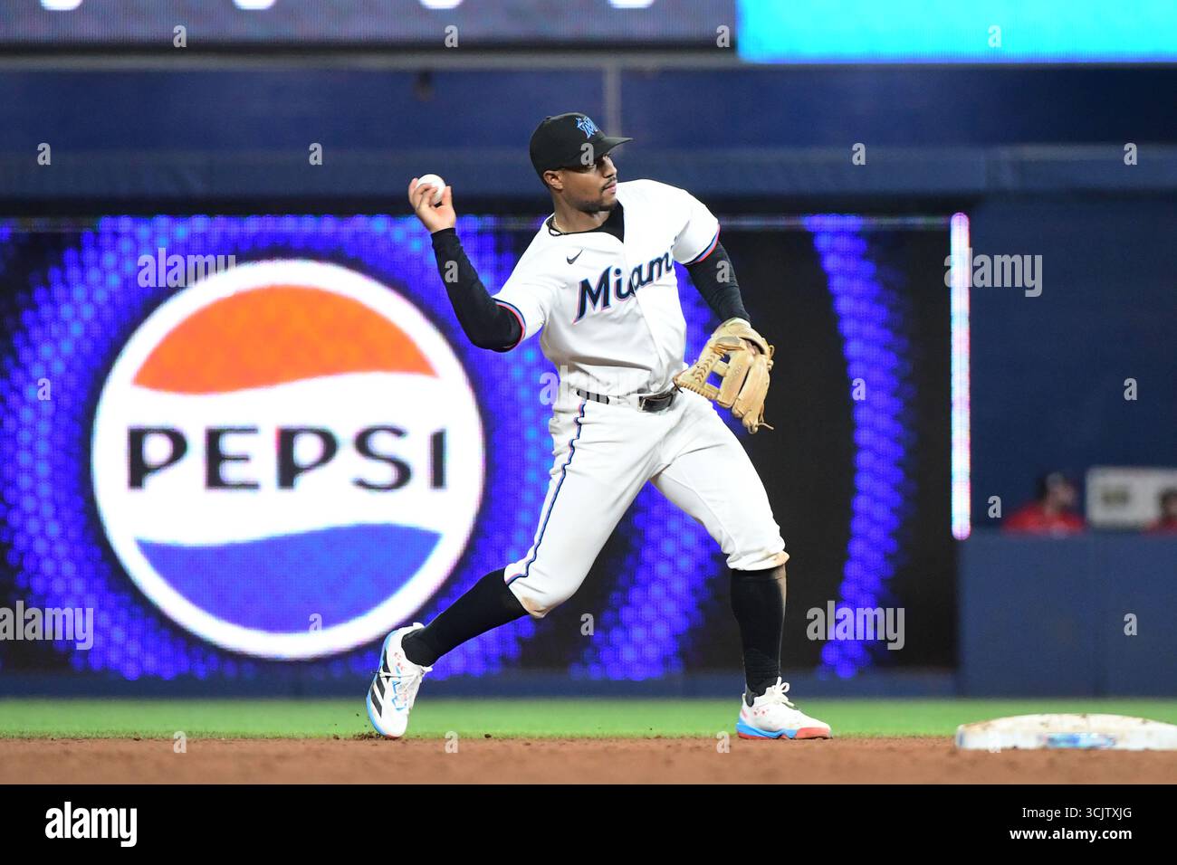 Miami Marlins shortstop Xavier Edwards (9) throws to first base in the ...
