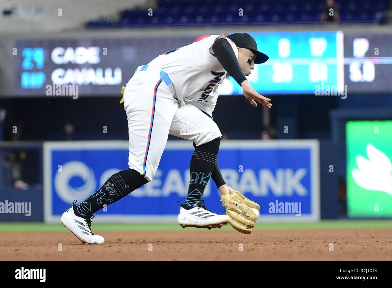 Miami Marlins shortstop Maximo Acosta (24) scoops up a gorund ball in the 6th inning at ...