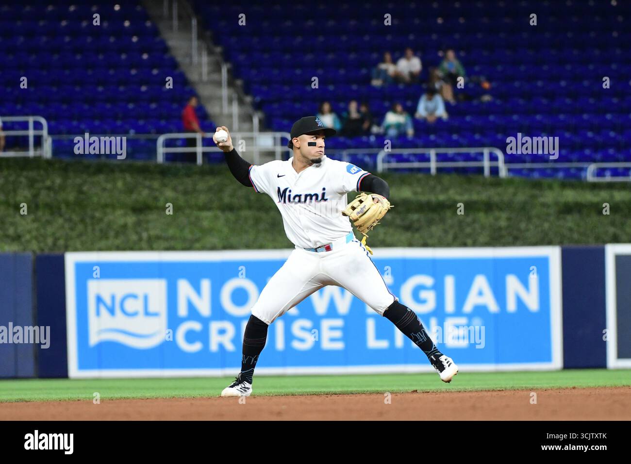 Miami Marlins shortstop Maximo Acosta (24) throws to first base in the ...