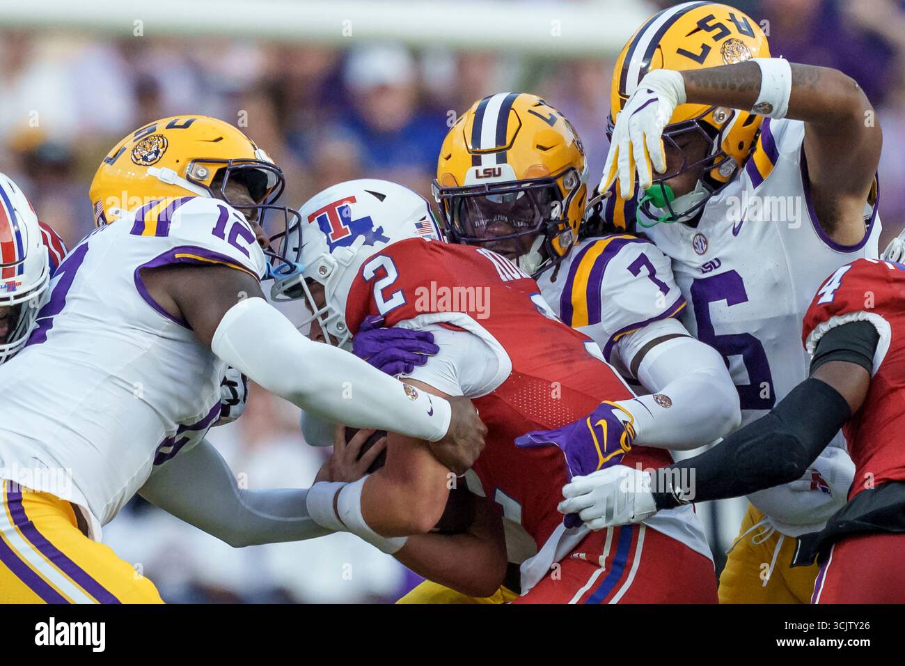 LSU linebacker Harold Perkins Jr. (7) sacks Louisiana Tech quarterback ...