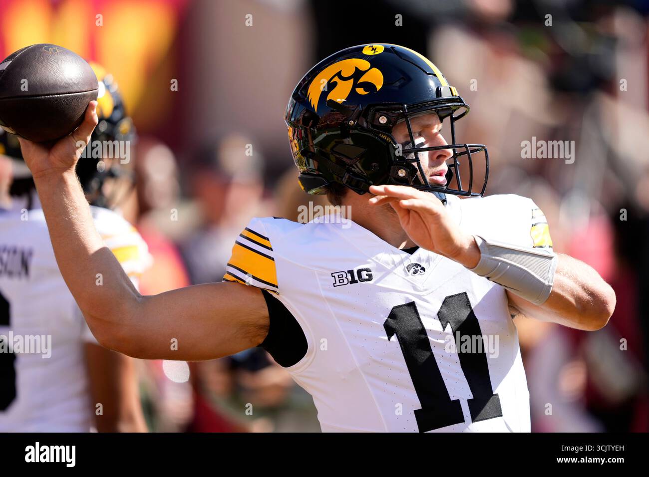 Iowa quarterback Mark Gronowski warms up before an NCAA college ...