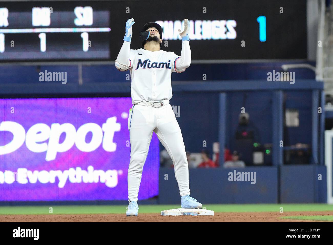 Miami Marlins center fielder Victor Mesa Jr. (10) raises his arms after hitting a double in the ...