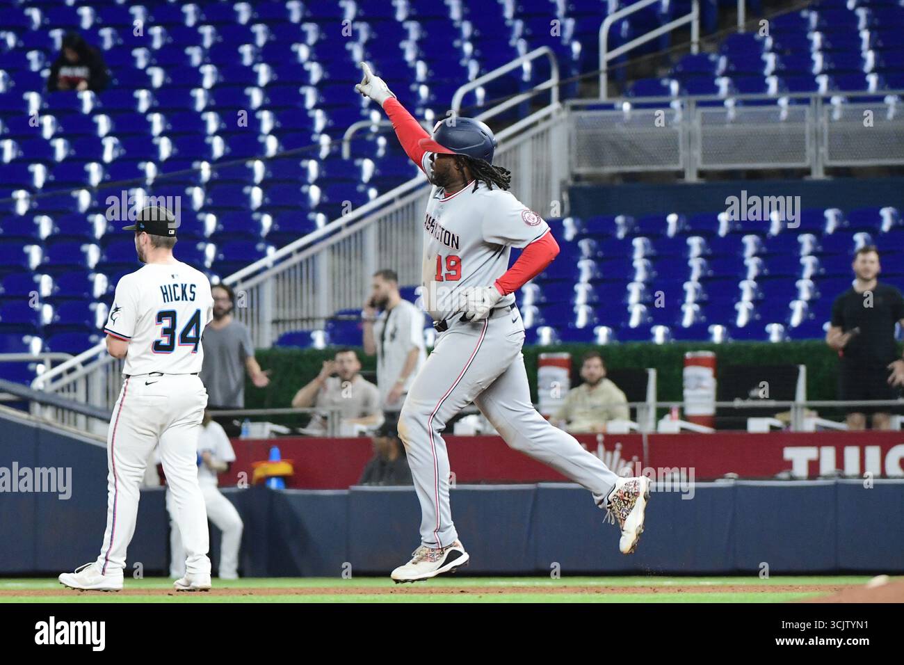 Washington Nationals first baseman Josh Bell (19) points to the bullpen ...
