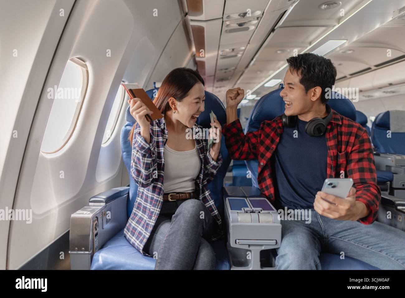 Young couple feeling excited and joyful while traveling together on an ...