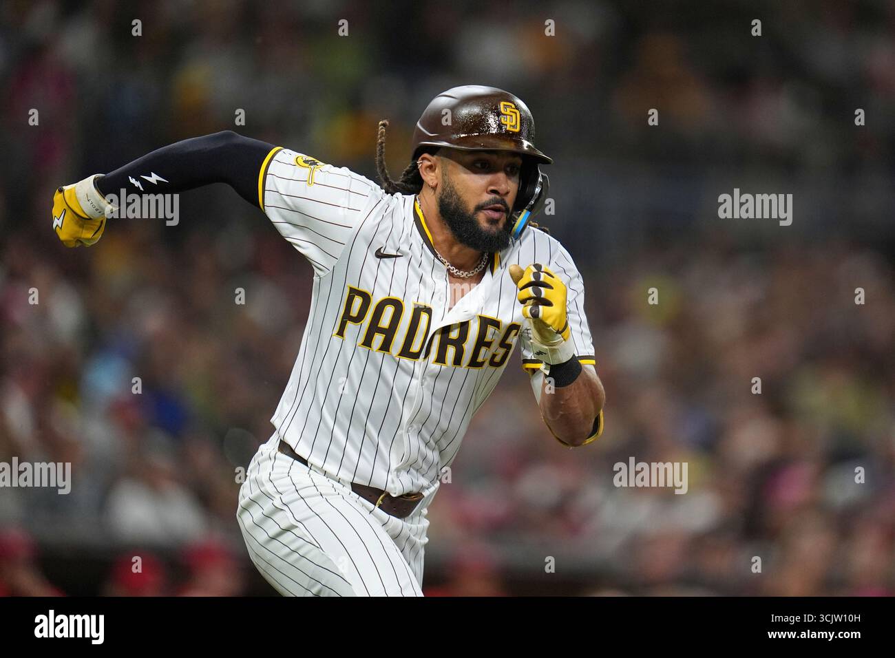 San Diego Padres' Fernando Tatis Jr. runs after hitting a single during ...